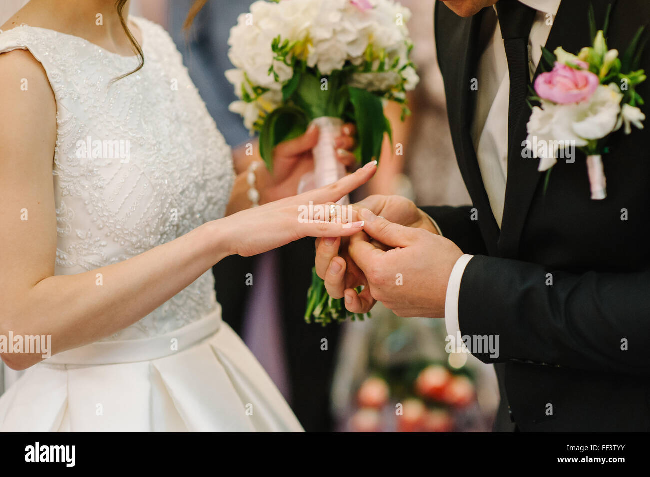 bride and groom are changing rings on their wedding Stock Photo - Alamy