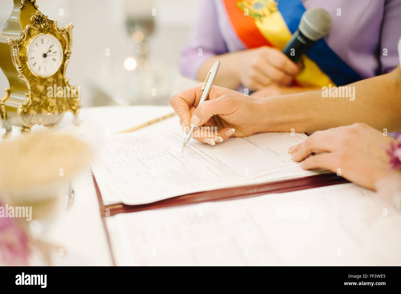 bride signs marriage certificate with a pen Stock Photo - Alamy