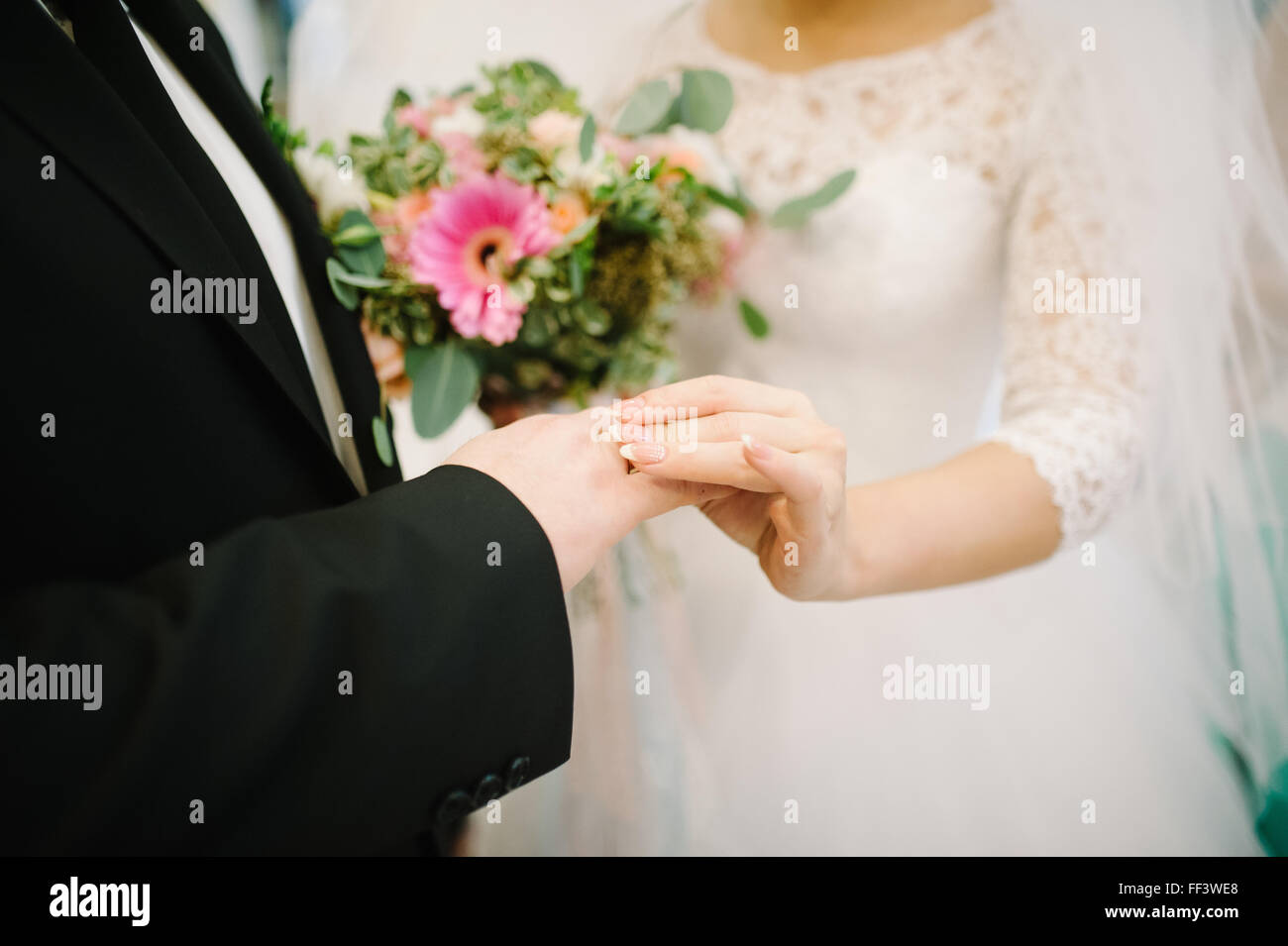 bride and groom are changing rings on their wedding Stock Photo - Alamy