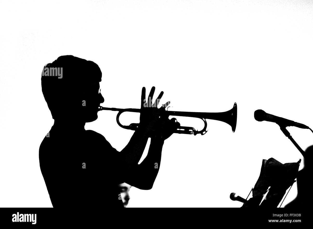 Black and white silhouetted trumpet player wearing glasses with a ...