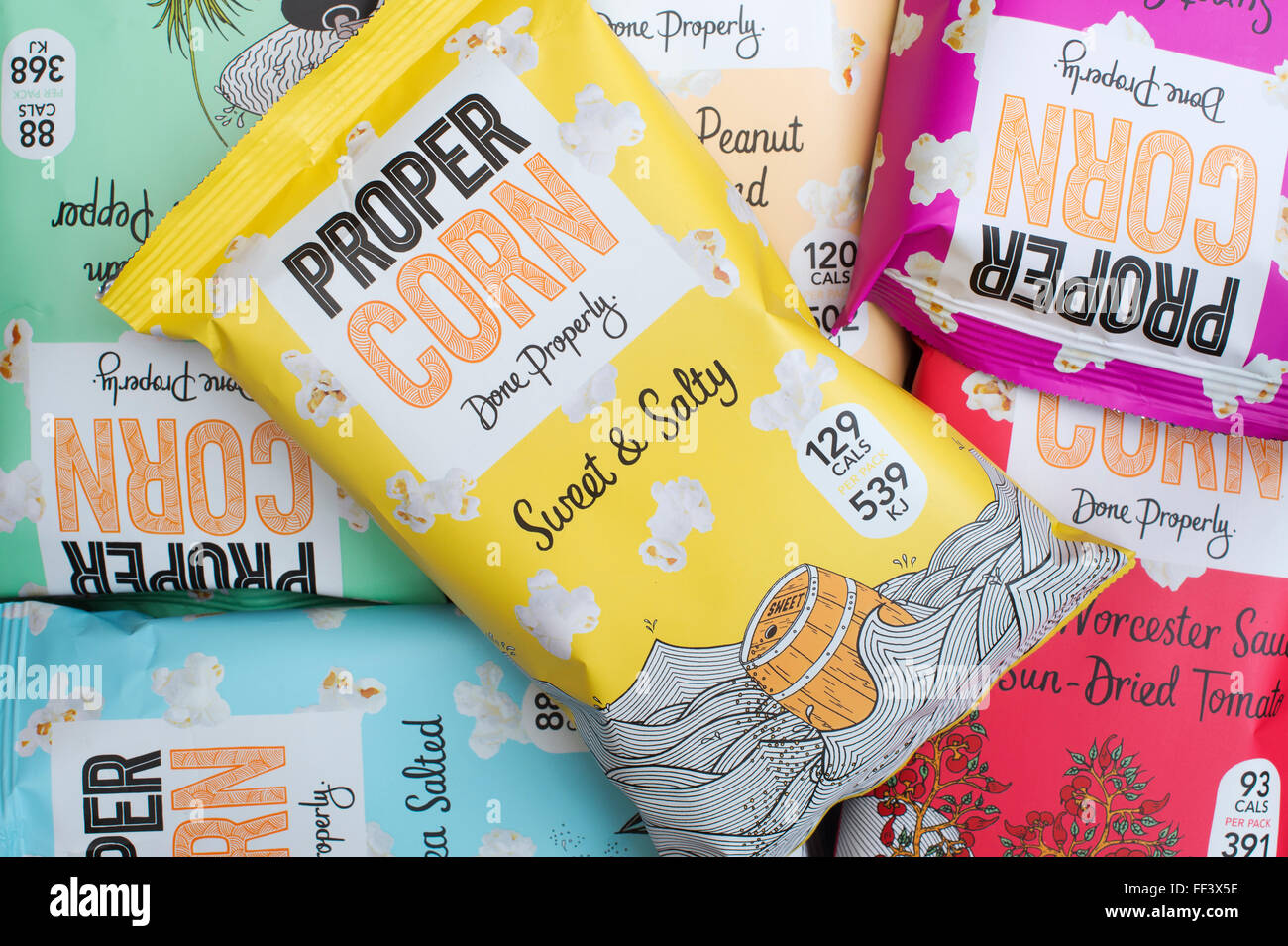Propercorn flavored popcorn packets Stock Photo - Alamy