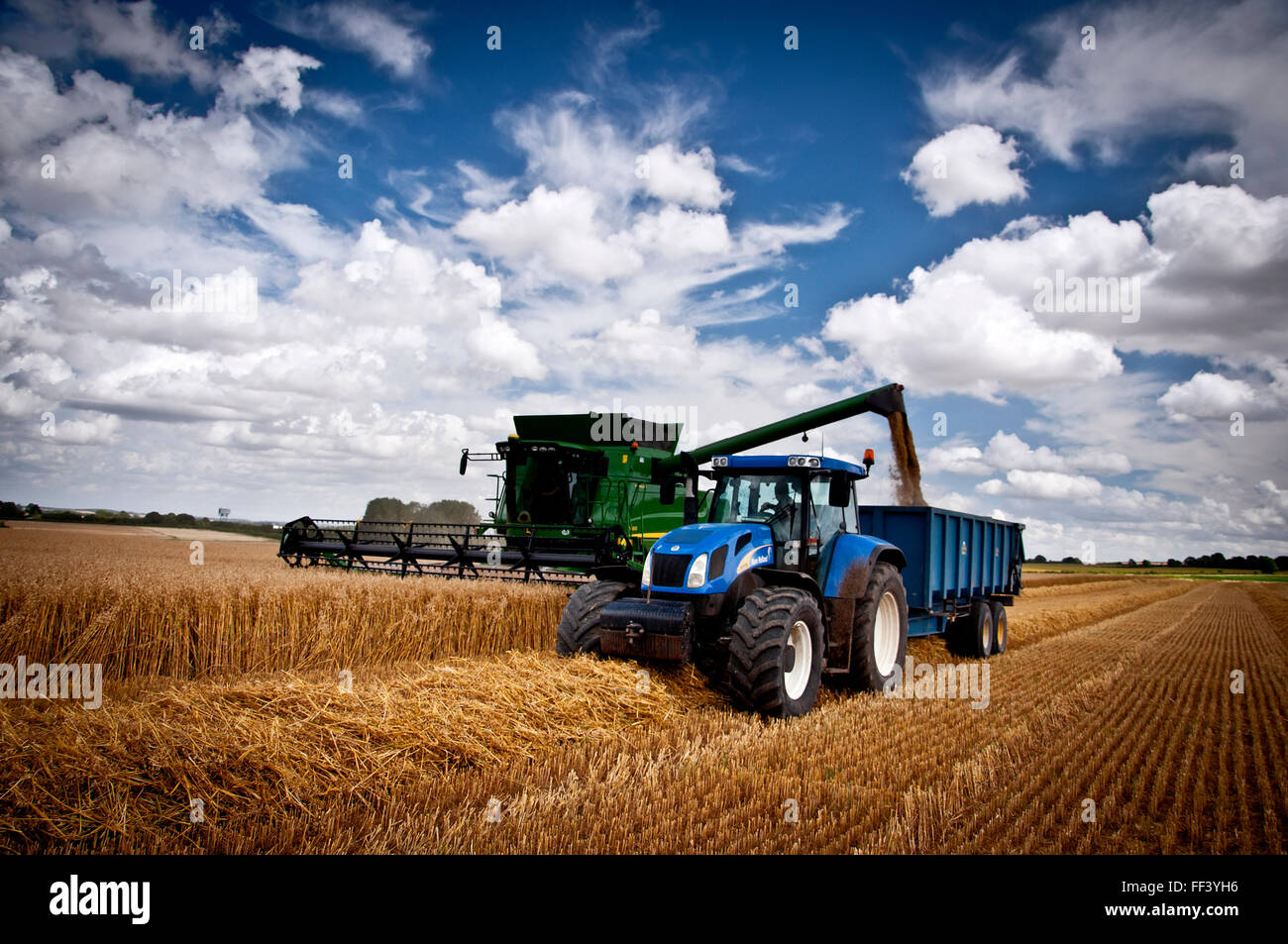 A Combine Harvester and Tractor Stock Photo - Alamy