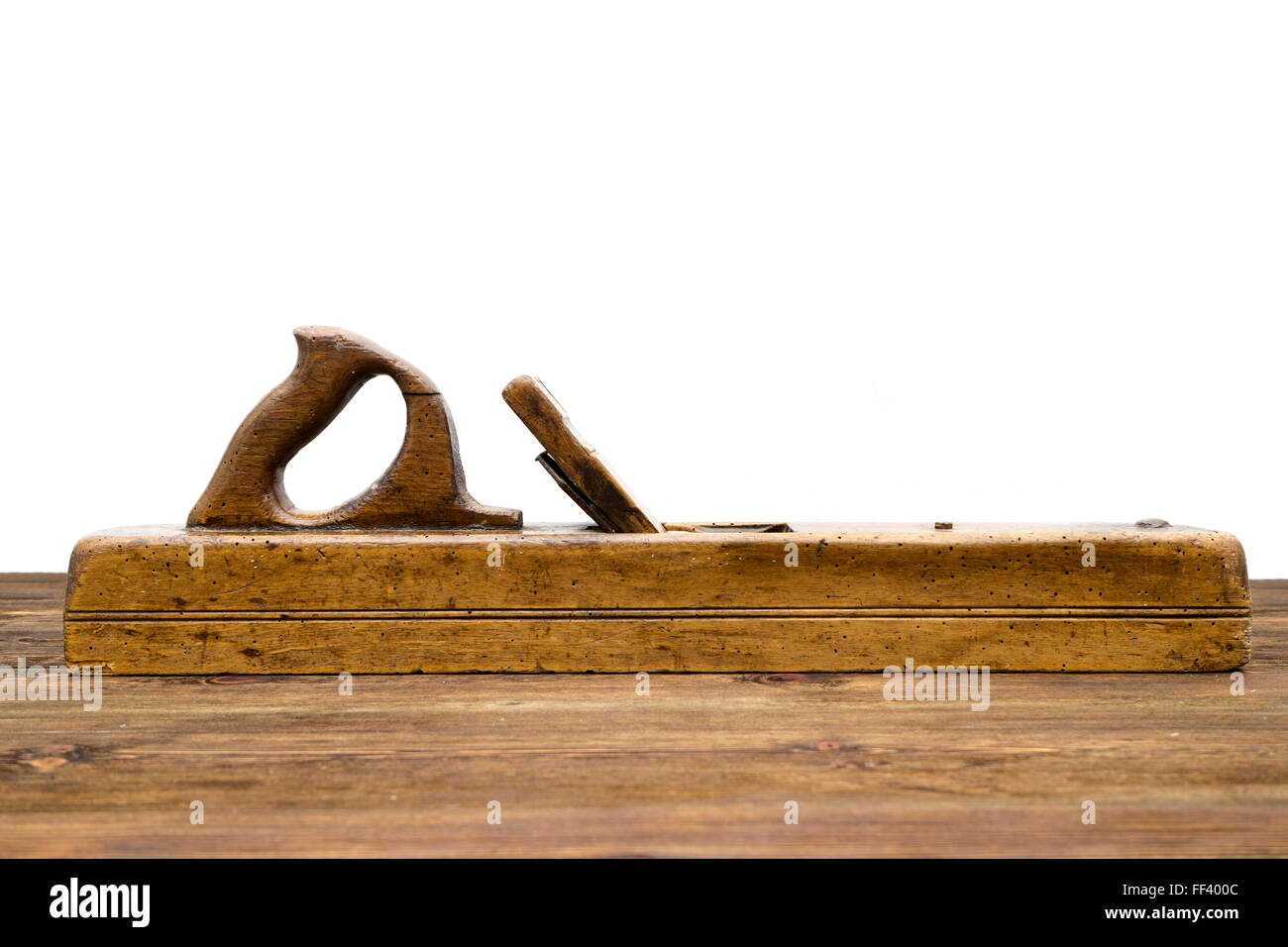 Old plane, isolated on a wooden background Stock Photo - Alamy