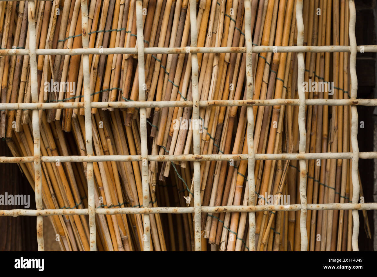 wire mesh and bundled reeds Stock Photo - Alamy