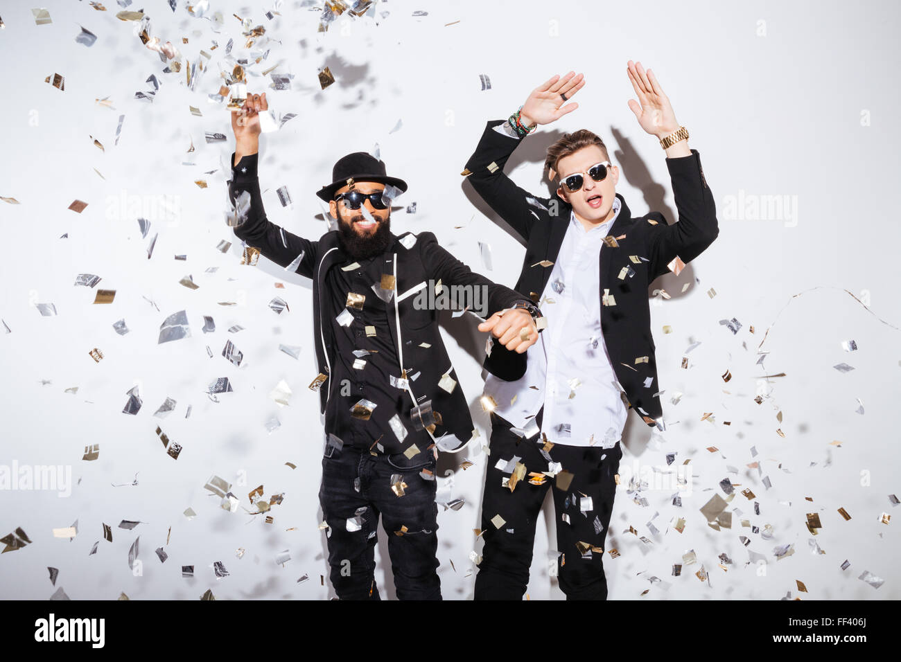 Two young men dancing on party Stock Photo - Alamy