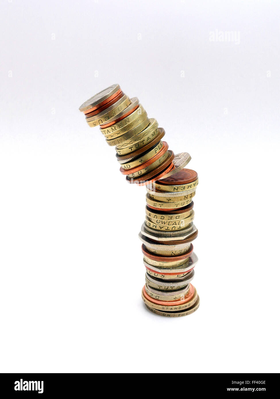 British coins in a pile collapsing Stock Photo - Alamy