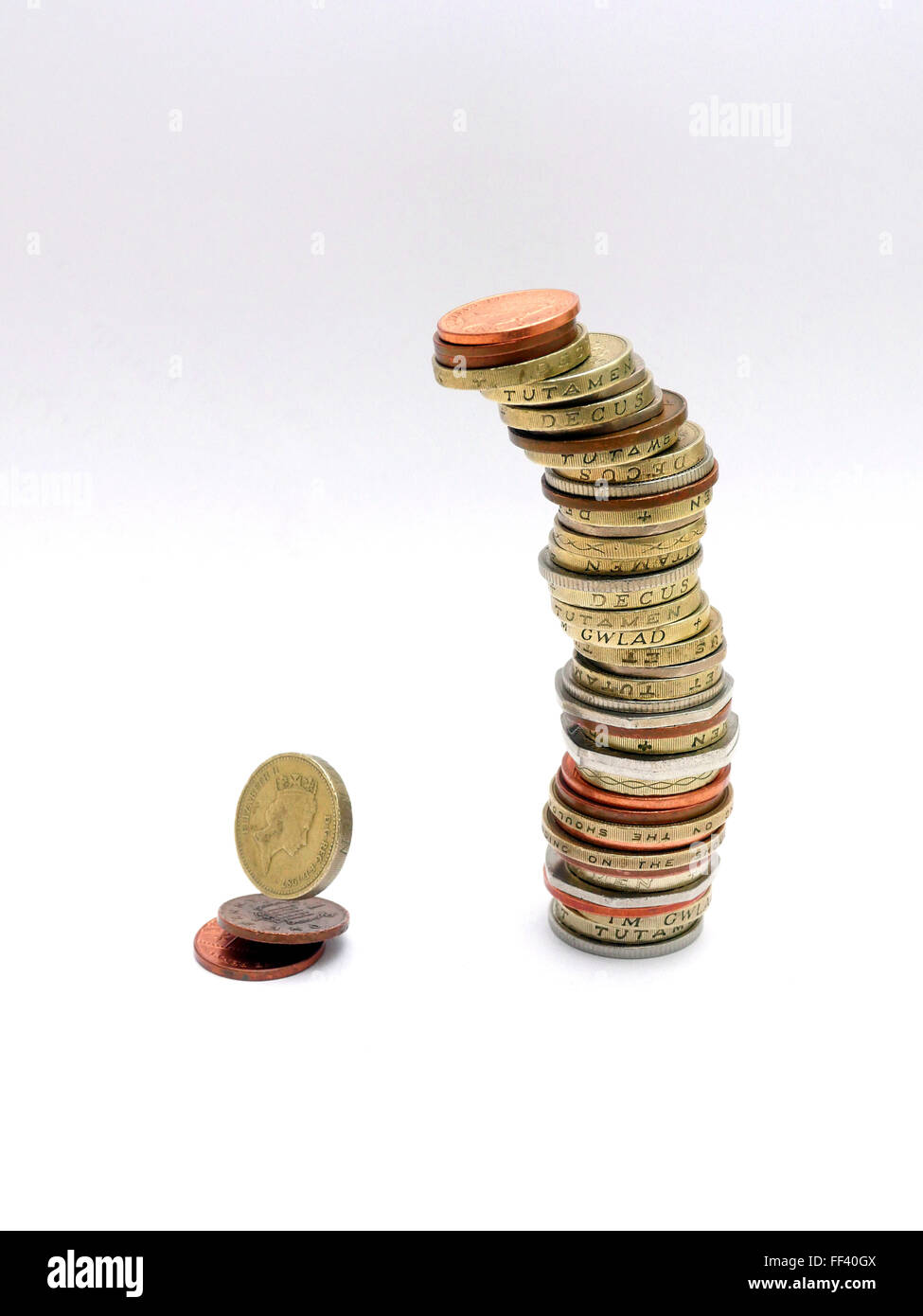 British coins in a pile collapsing Stock Photo - Alamy