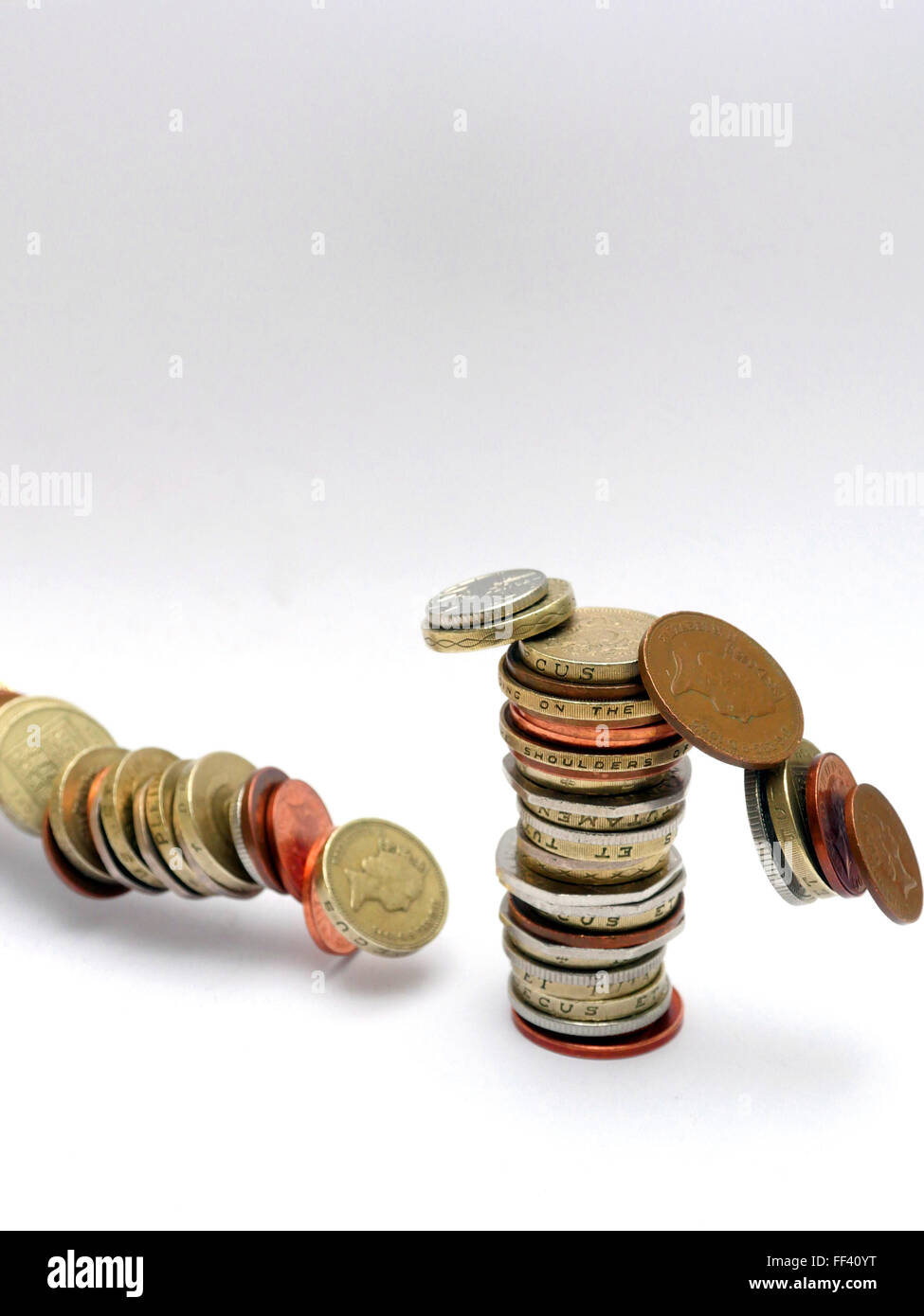 British coins in a pile collapsing Stock Photo - Alamy