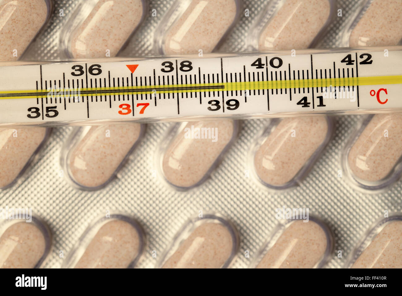 Thermometer and pills Stock Photo - Alamy