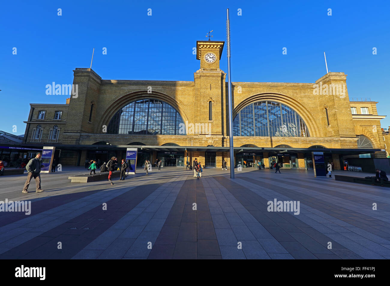 Grand façade of Kings Cross station with its characteristic yellow ...