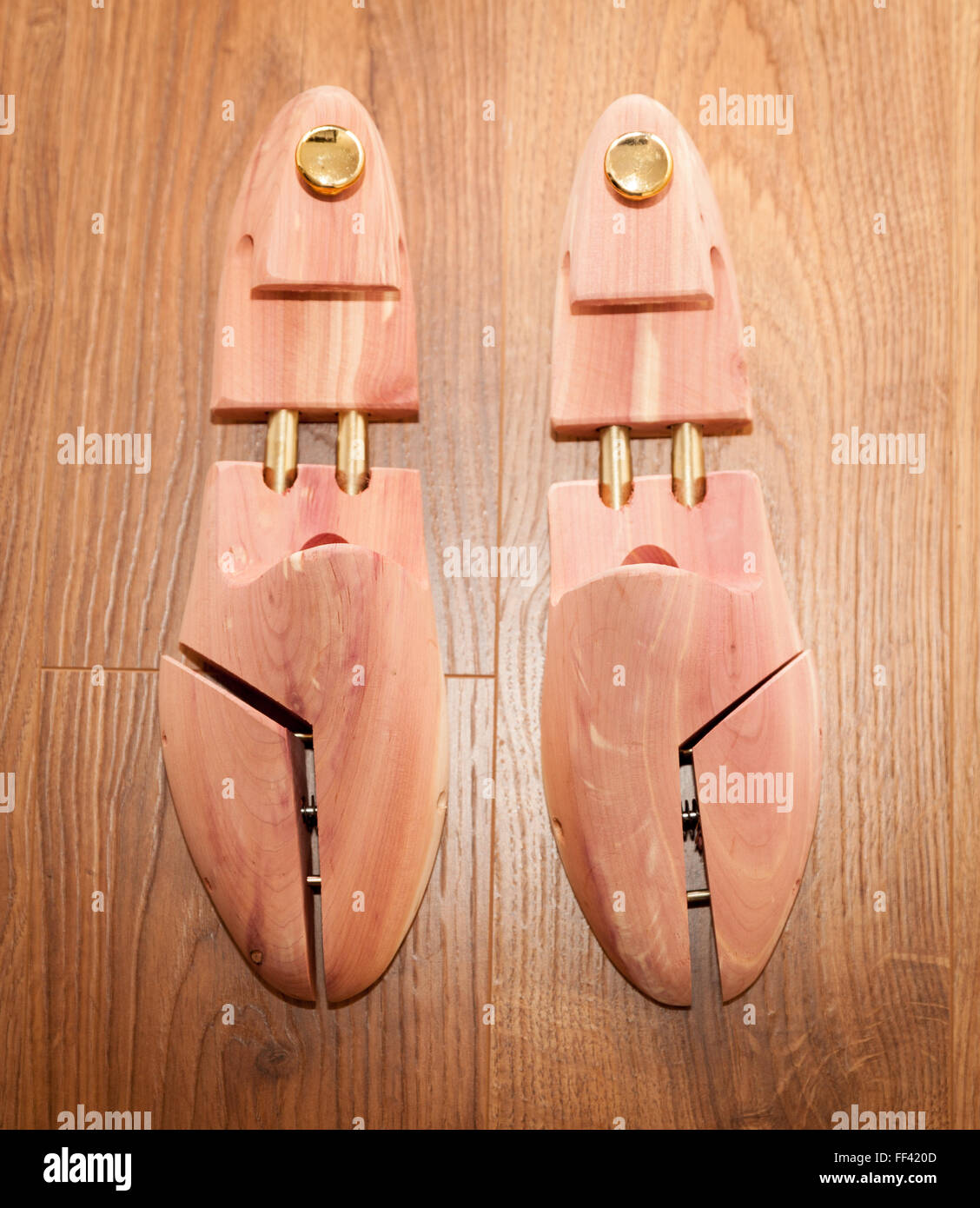 Classic cedar wood shoe trees with wood backdrop Stock Photo - Alamy