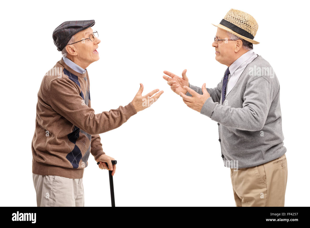 Studio shot of two senior gentlemen arguing with each other isolated on ...