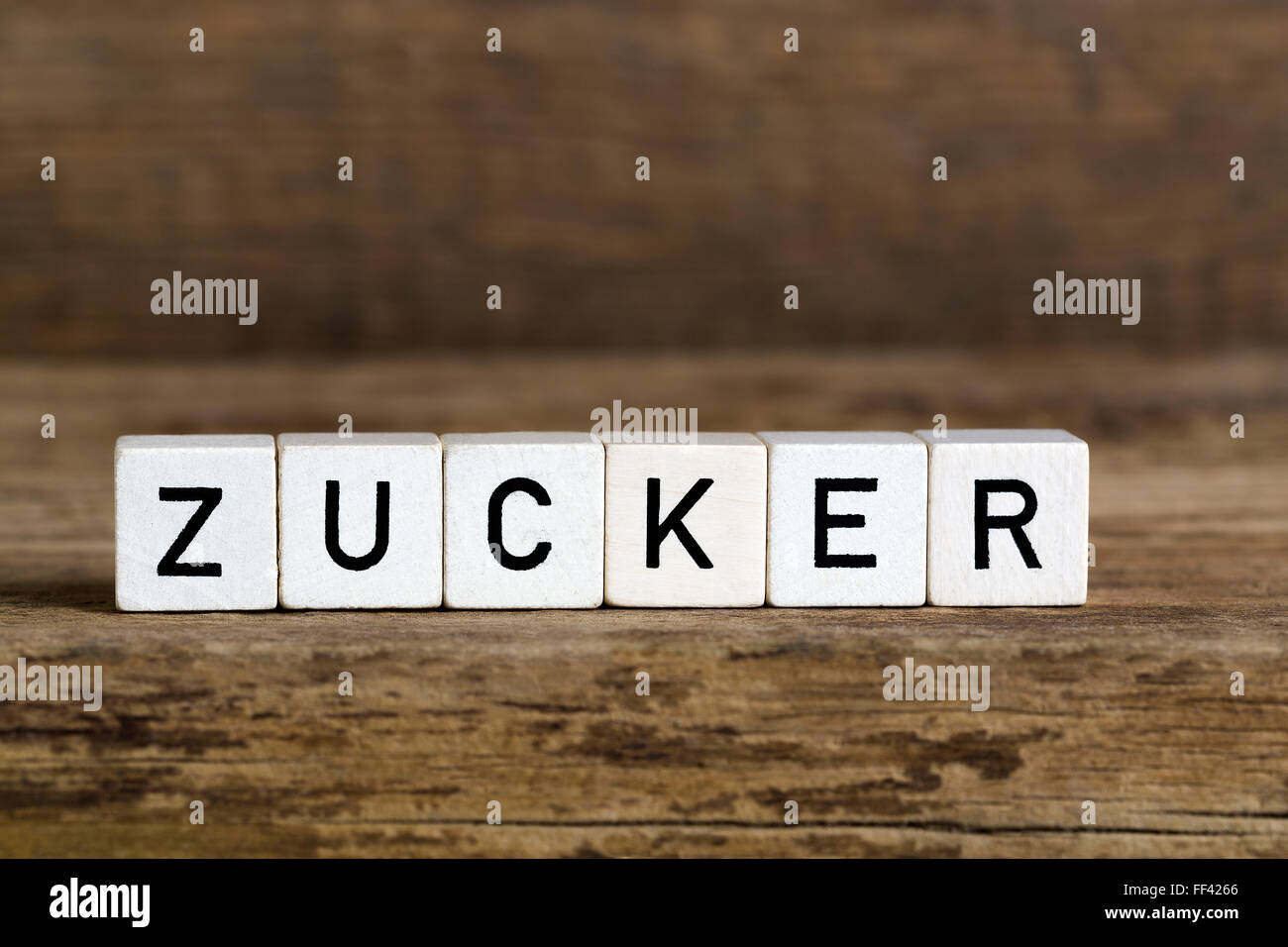 The German word sugar written in cubes on a wooden background Stock ...