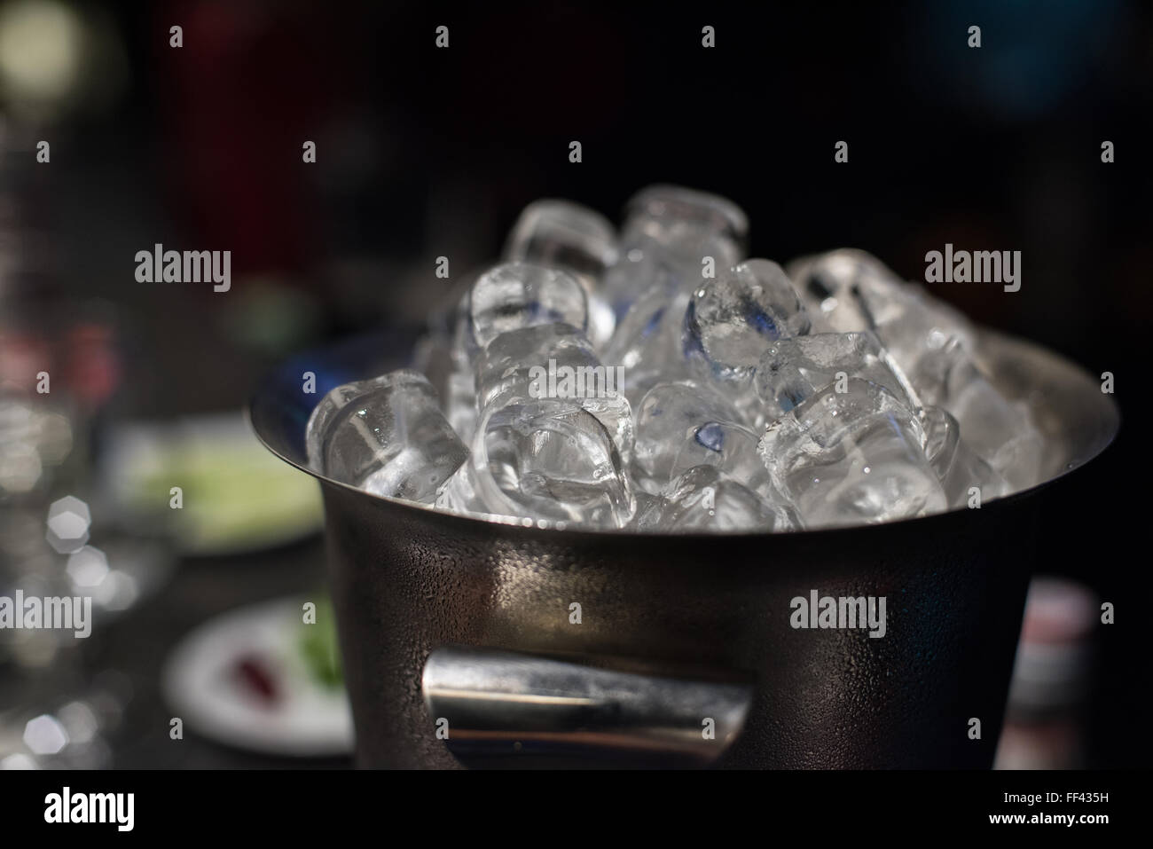 Ice bucket with ice cubes Stock Photo - Alamy