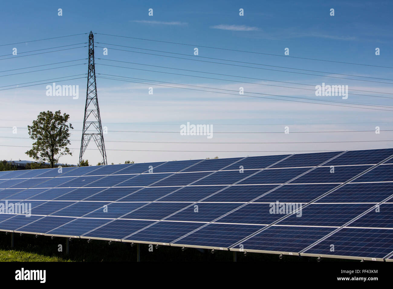 Solar panels and electricity pylons at the Solar array of community ...
