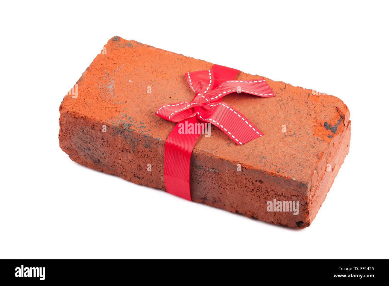 brick in a gift with bow and ribbon isolated Stock Photo - Alamy