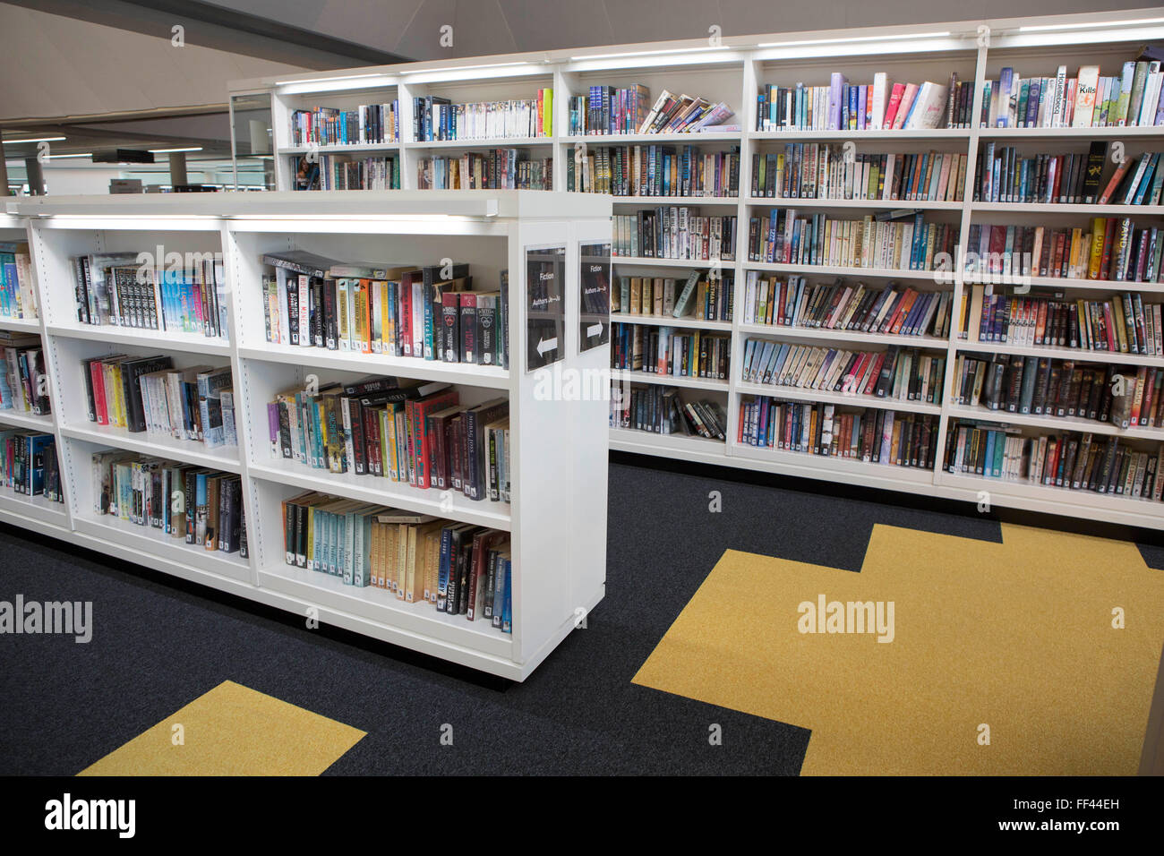 Book shelves with integrated lighting inside the library of the Hive in ...
