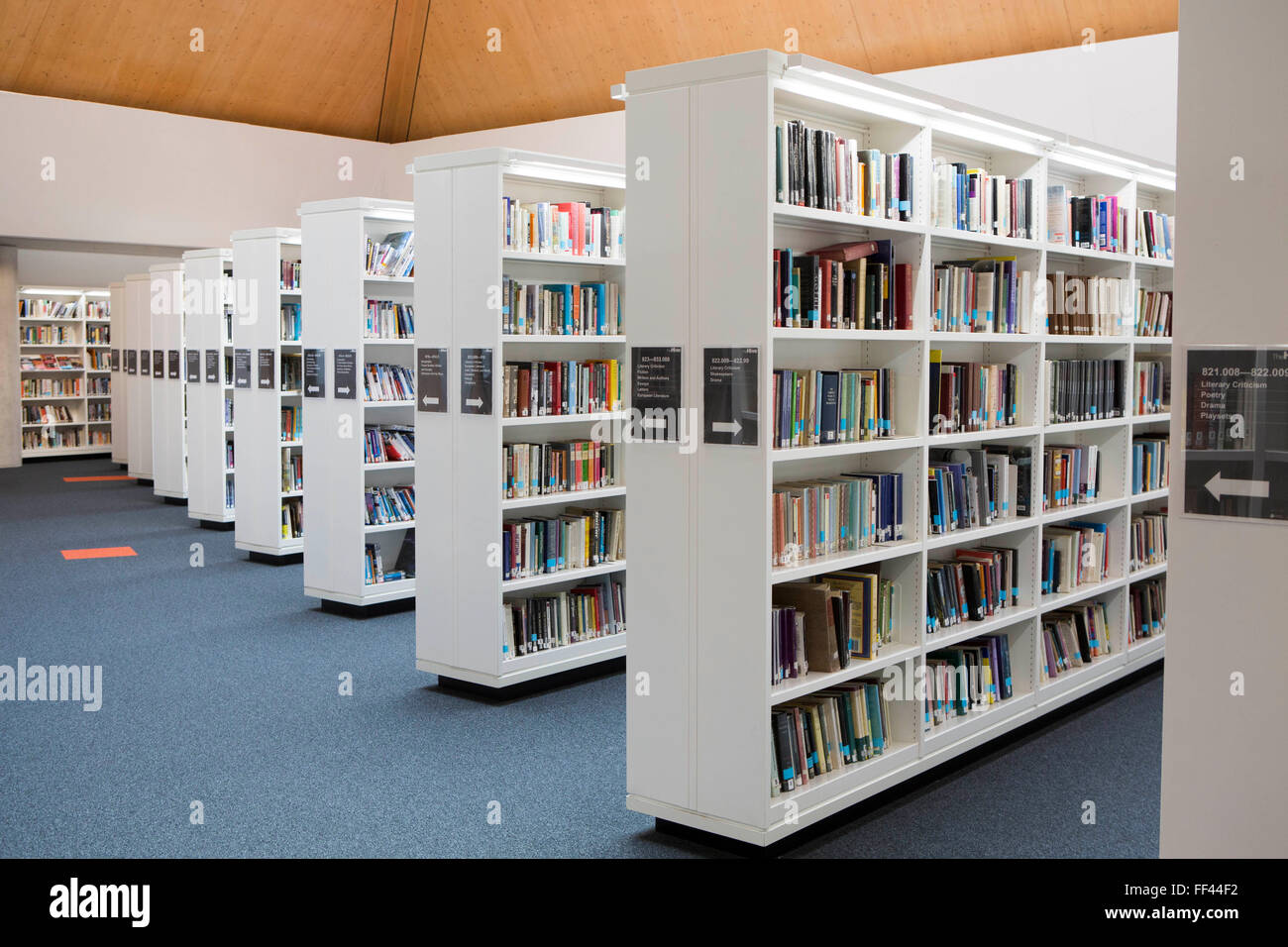 Book shelves with integrated lighting inside the library of the Hive in ...