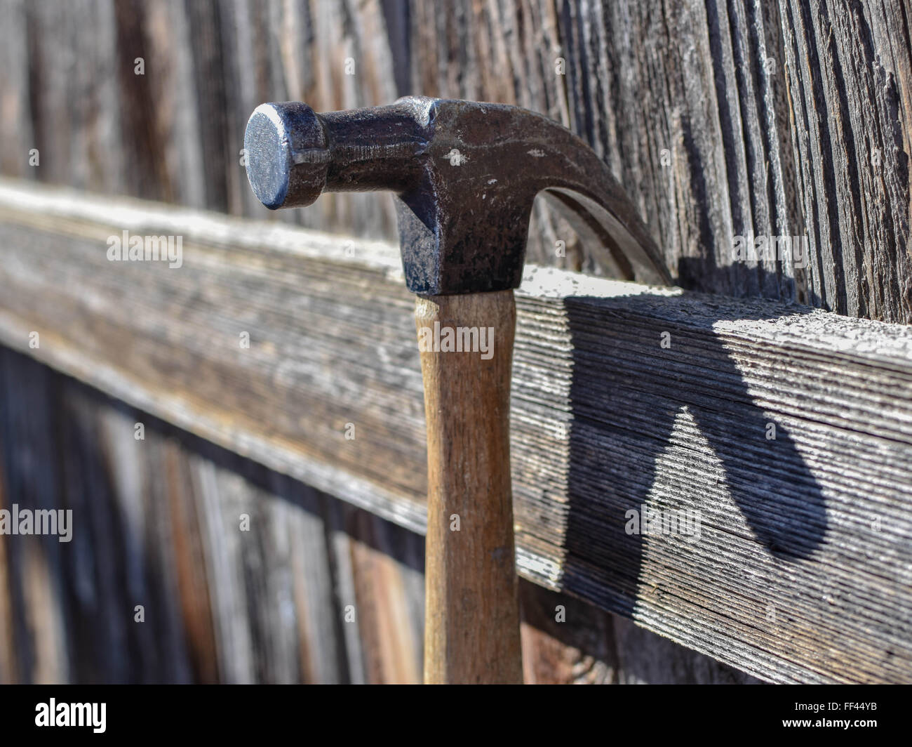 Hammer on a Fence Stock Photo - Alamy