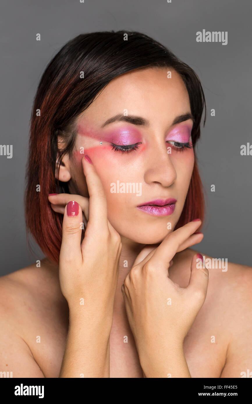 Young caucasian woman wearing a make-up Stock Photo - Alamy