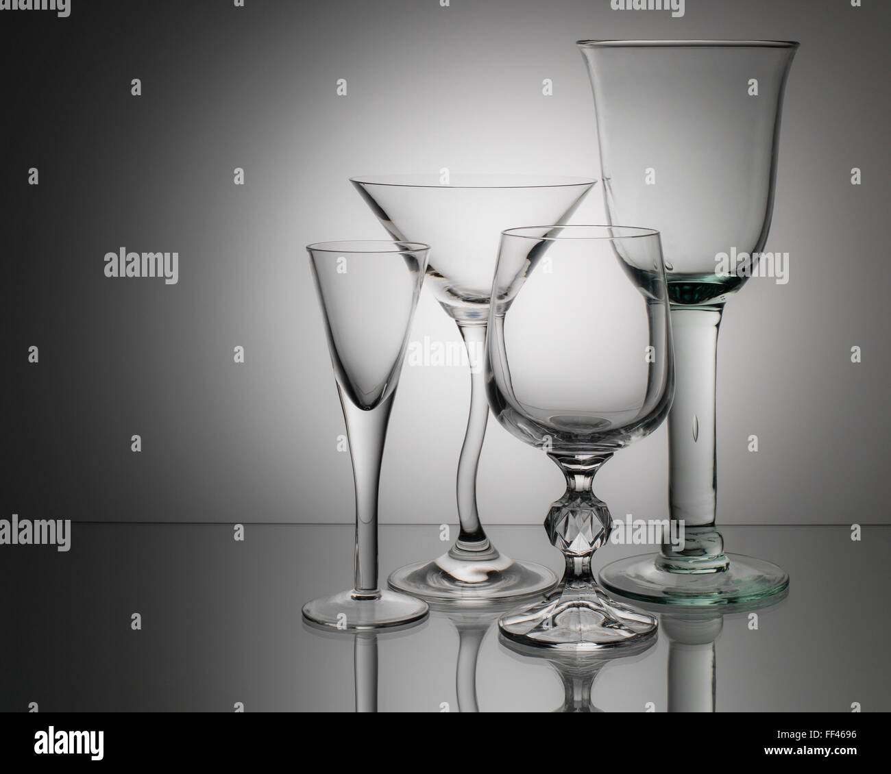 Empty glasses of different kind Stock Photo - Alamy