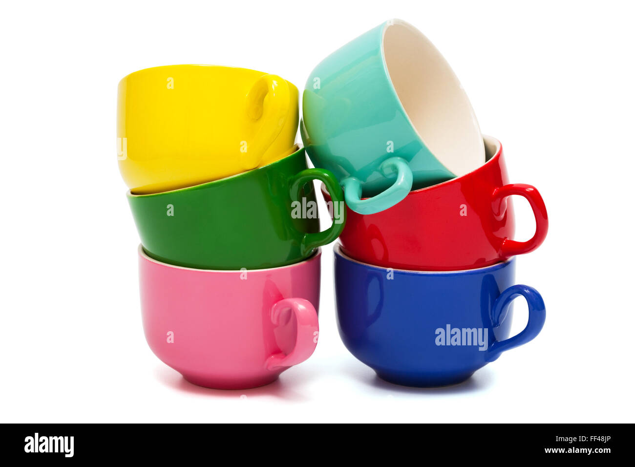 Beautiful color cups on a white background Stock Photo - Alamy
