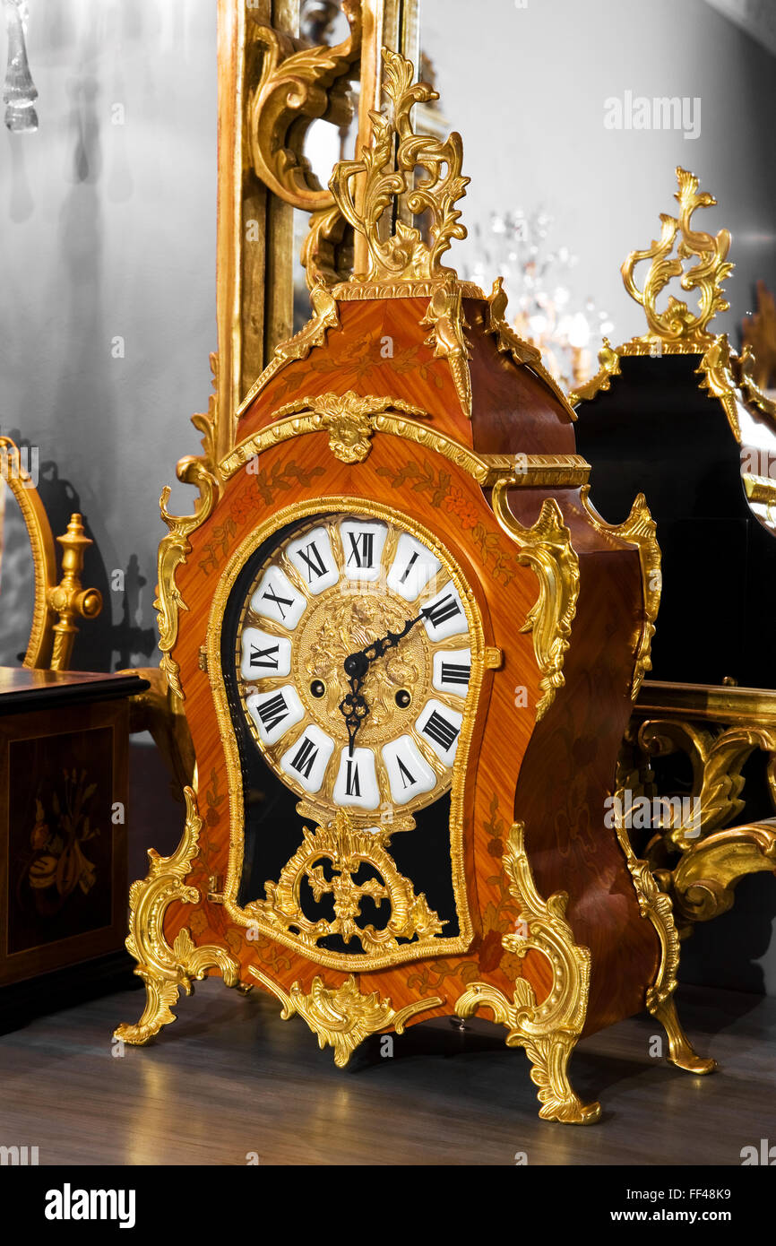 beautiful antique clock on the background of the mirror Stock Photo - Alamy