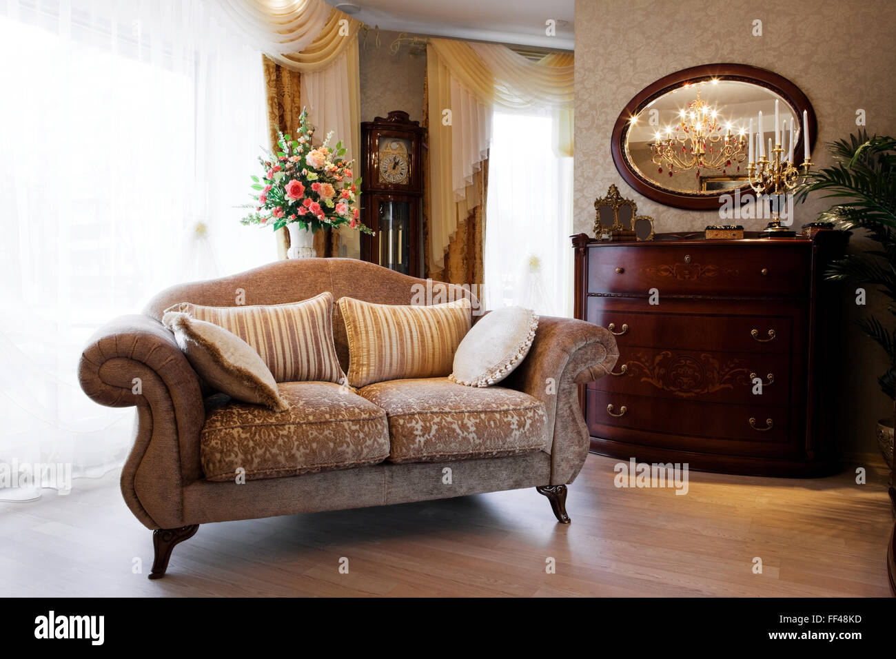 Beautiful sofa at a window in a modern apartment Stock Photo - Alamy