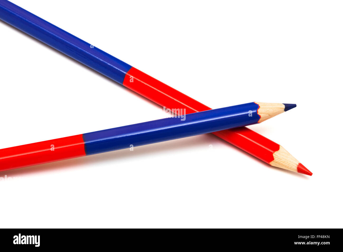 two colored pencil on a white background Stock Photo - Alamy