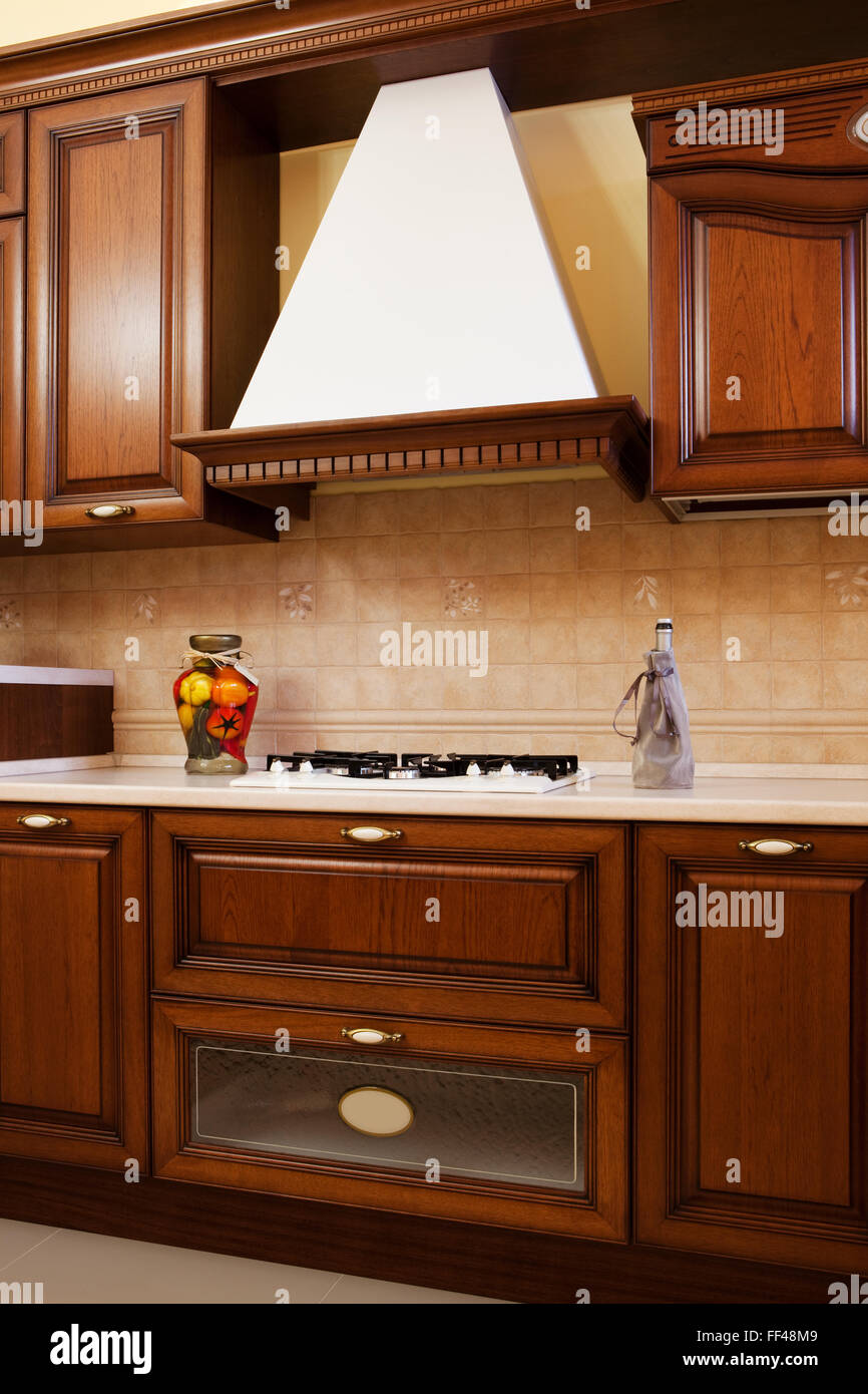 New modern gas cooker on wooden kitchen Stock Photo - Alamy