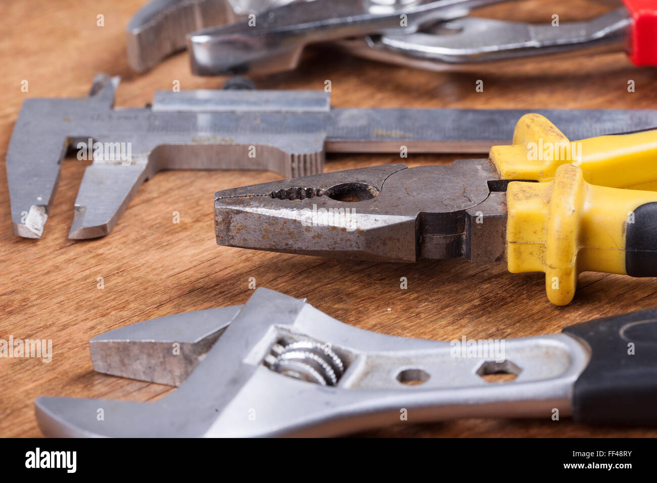 group of tools on wooden background Stock Photo - Alamy