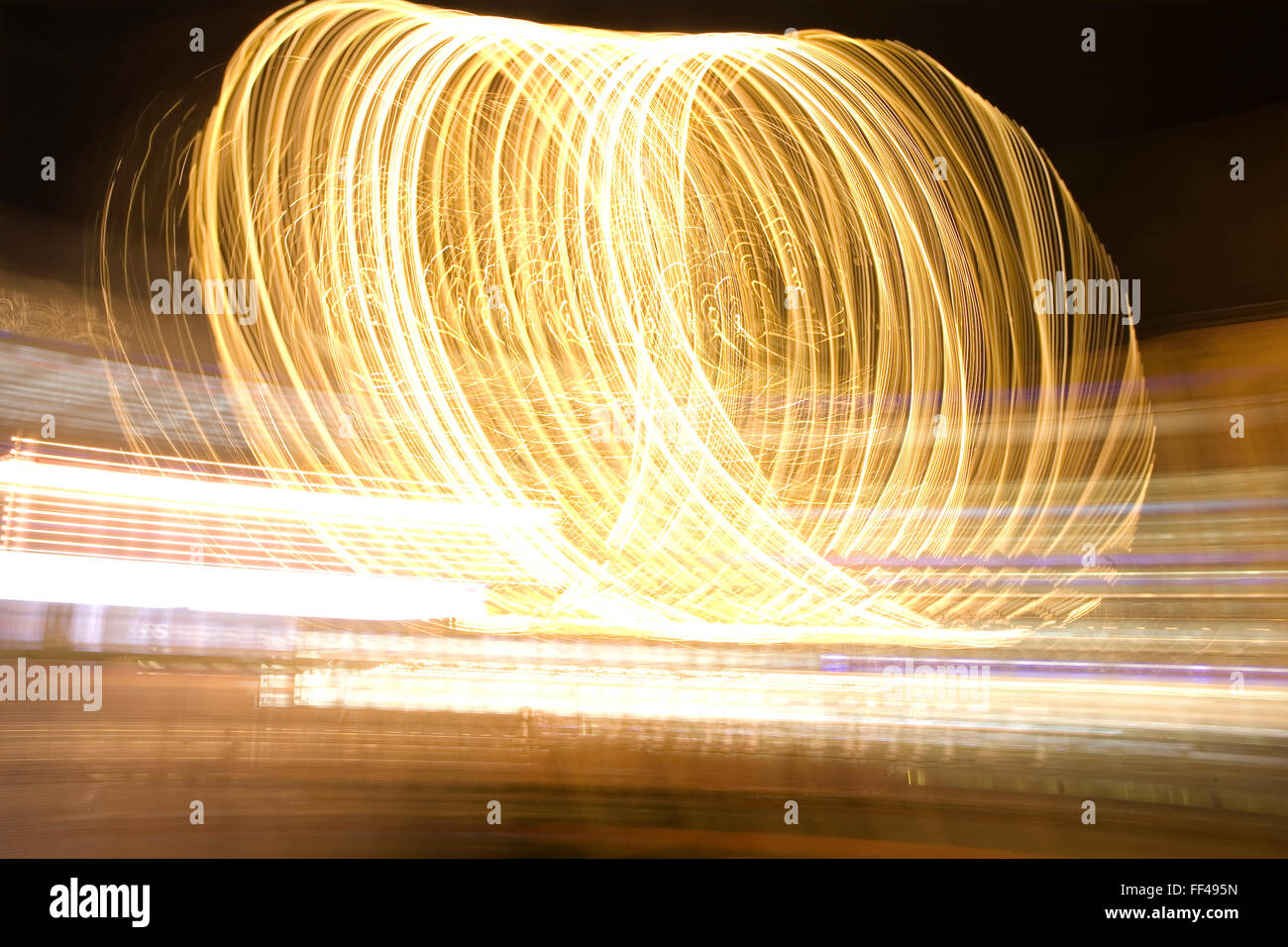 Motion Blur of a Rotating Ferris Wheel at Night Stock Photo - Alamy