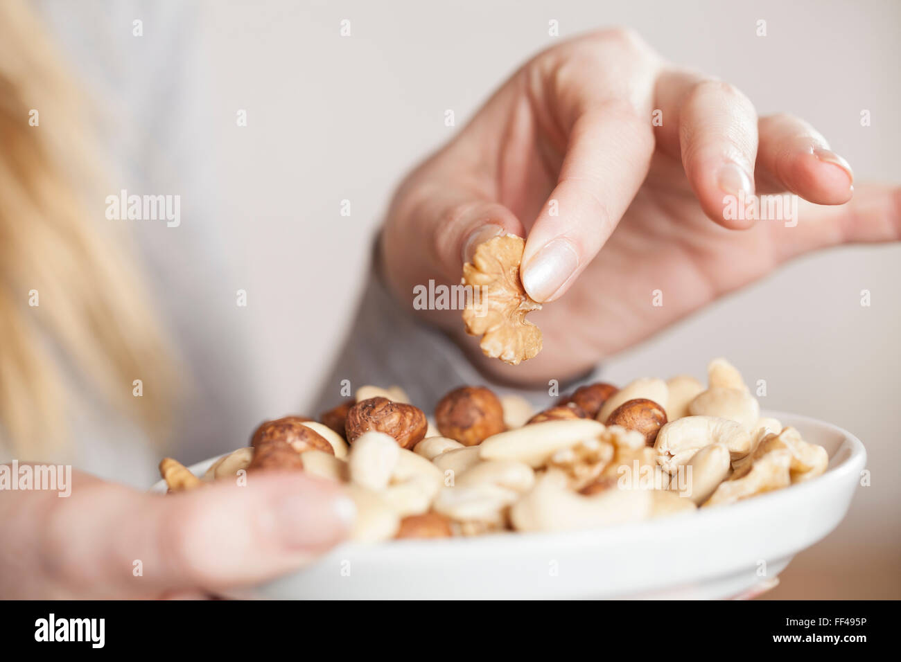 Woman and nuts hi-res stock photography and images - Alamy