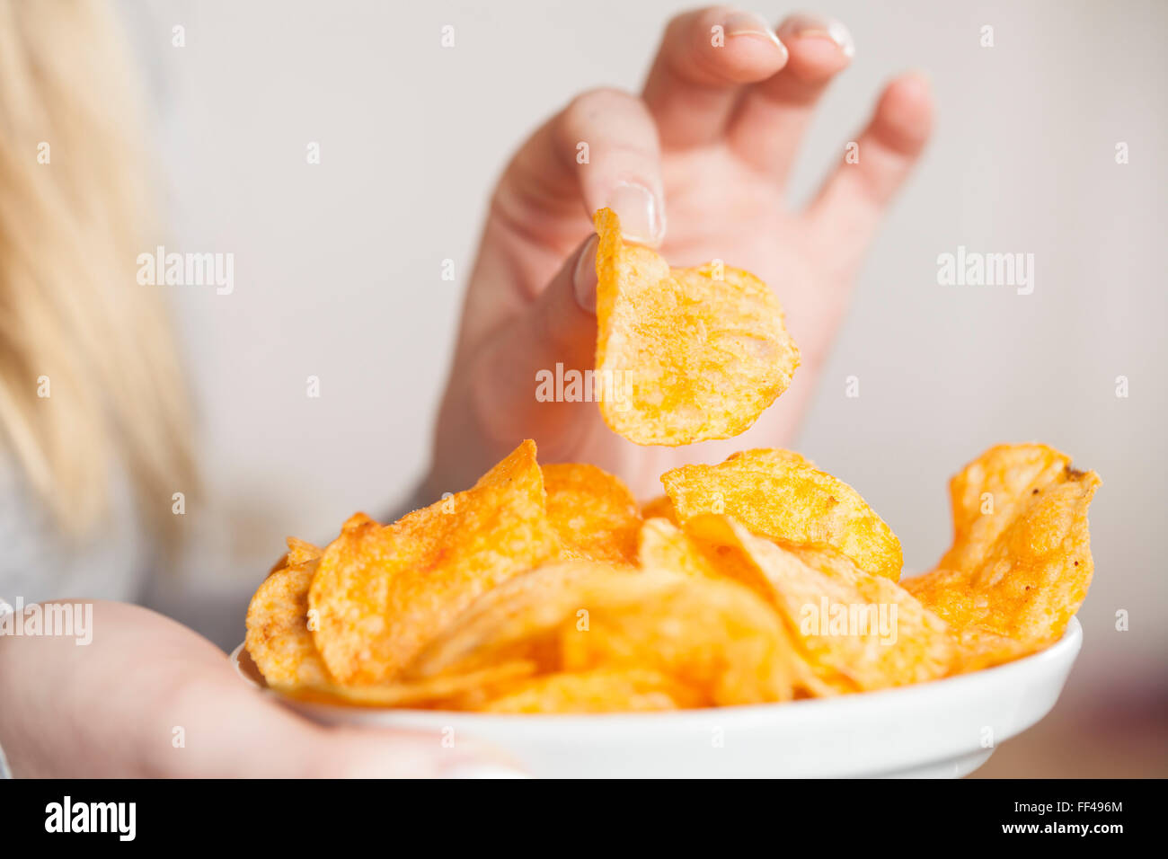 Woman Eating Chips High Resolution Stock Photography and Images - Alamy