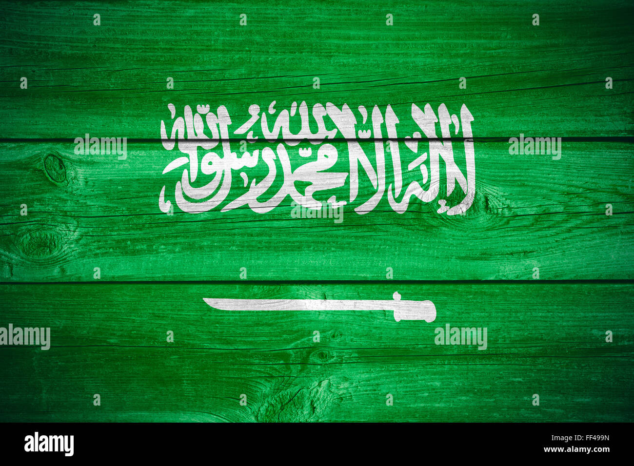 flag of Saudi Arabia or Saudi Arabian banner on wooden background Stock ...