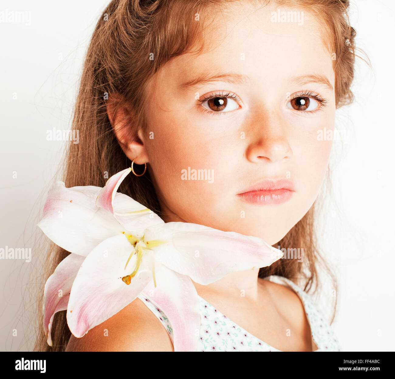 little cute spring girl with lily flower in fancy dress isolated on ...