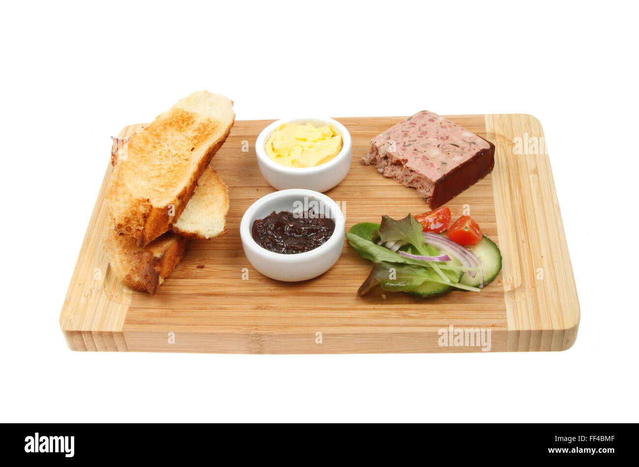 Farmhouse pate with toast, butter, red onion marmalade and salad on a ...