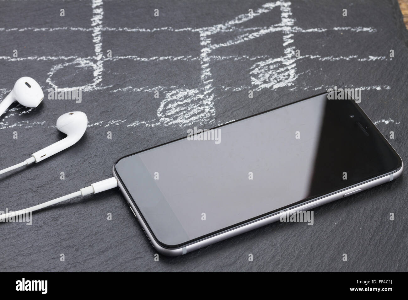 Music notes with headphones Stock Photo - Alamy