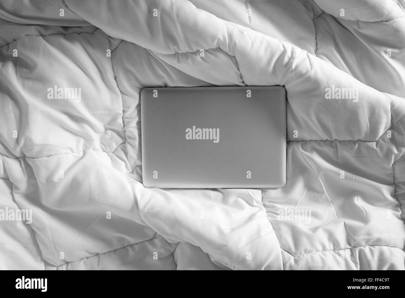 Using laptop on bed Black and White Stock Photos & Images - Alamy