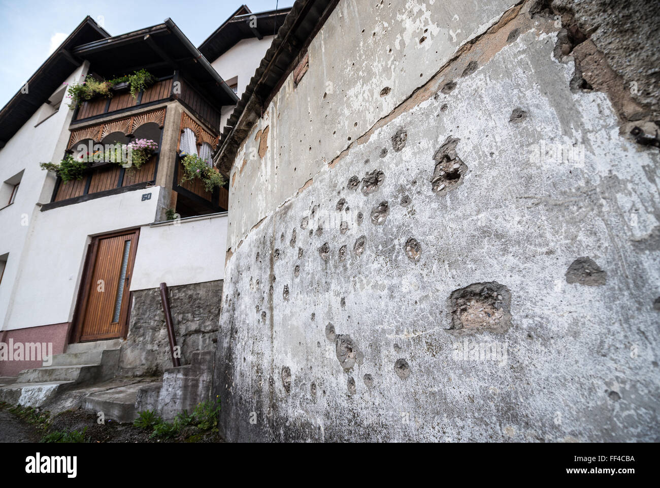 Bullet Holes In House Wall