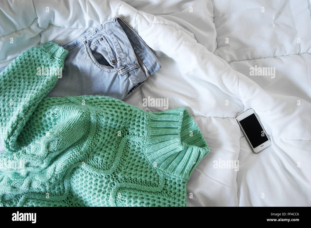 Clothes laid out on bed hi-res stock photography and images - Alamy