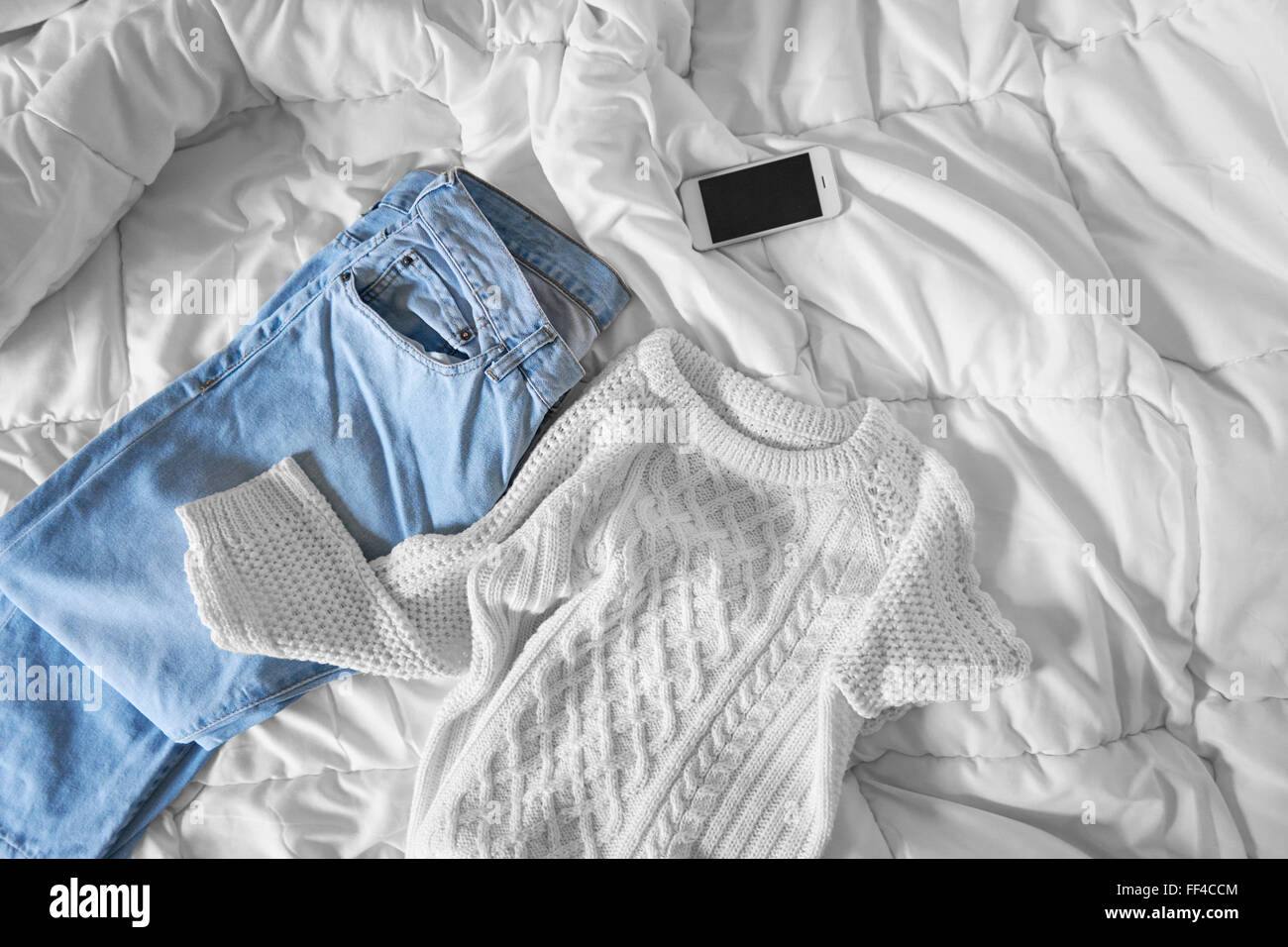 Clothes laid out on bed hi-res stock photography and images - Alamy