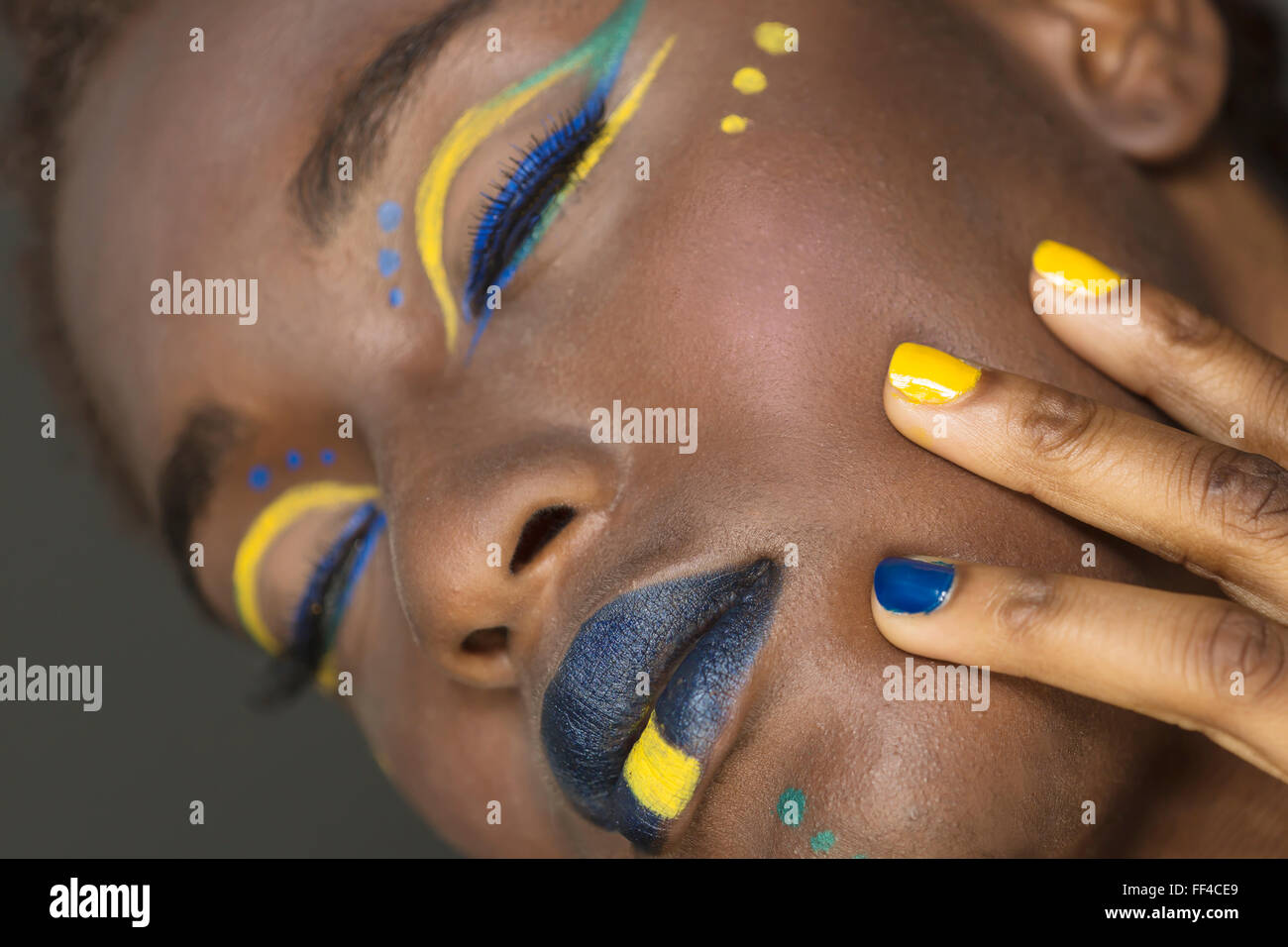 Young African woman wearing a make-up Stock Photo - Alamy