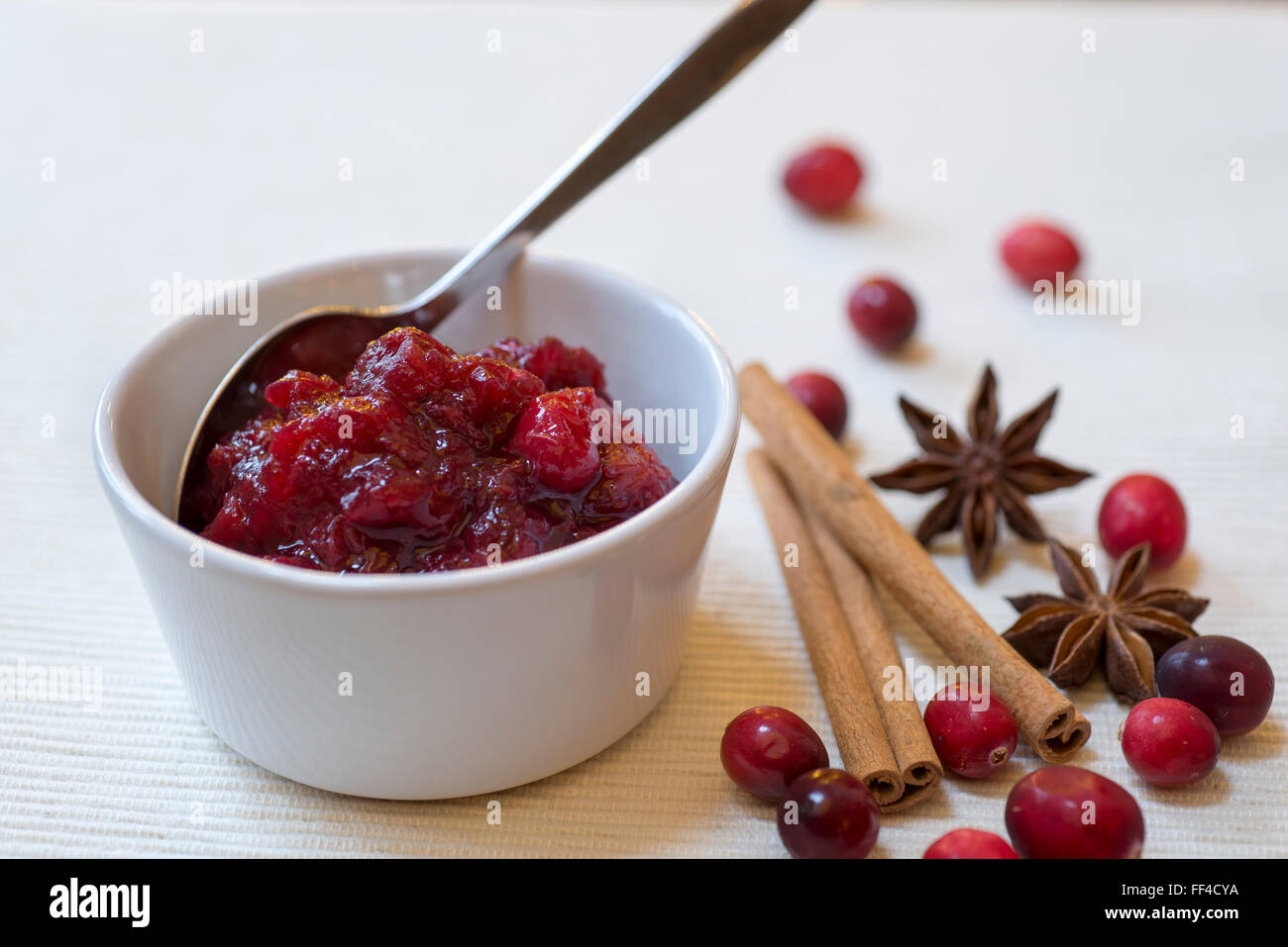 Fresh cranberry sauce with spices on a cream background Stock Photo - Alamy