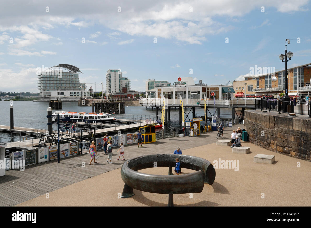 Cardiff Bay waterfront and Mermaid Quay quayside celtic ring sculpture ...