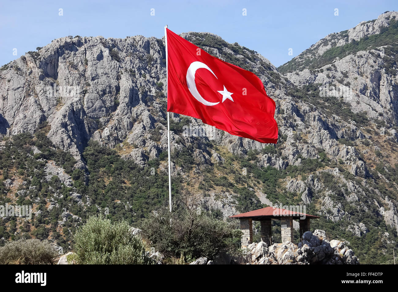 Waving the Turkish flag in the wind on a background of mountains Stock ...