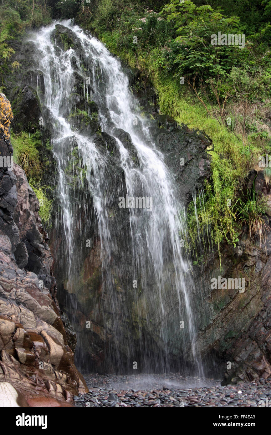 Waterfall on beach in Clovelly Devon Stock Photo - Alamy