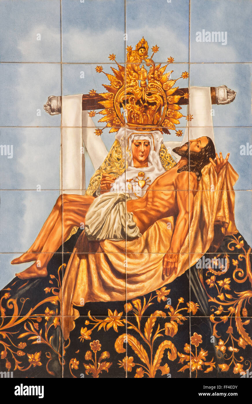 CORDOBA, SPAIN - MAY 26, 2015: The ceramic tiled Pieta on the facade of ...