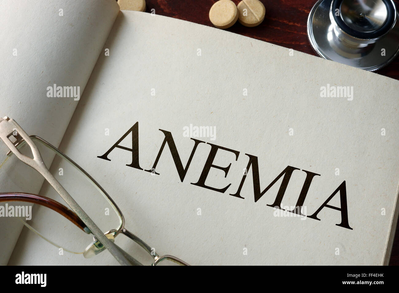 Book with diagnosis anemia and pills. Medical concept Stock Photo - Alamy