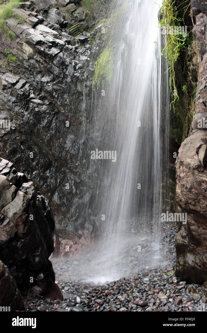 Waterfall on beach in Clovelly Devon Stock Photo - Alamy